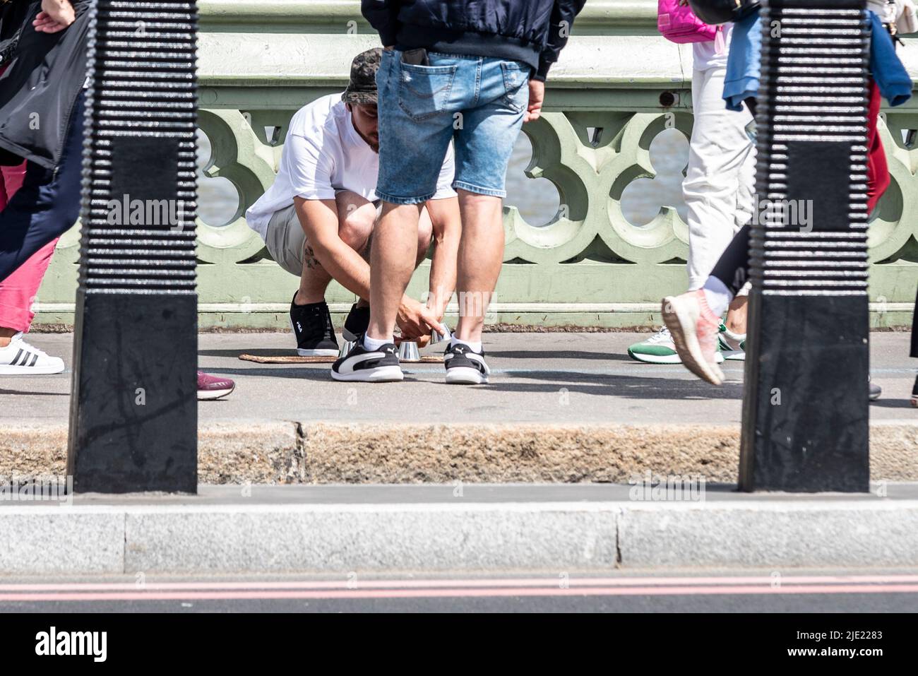 Shell game, or Find the Lady being played on Westminster Bridge, London ...