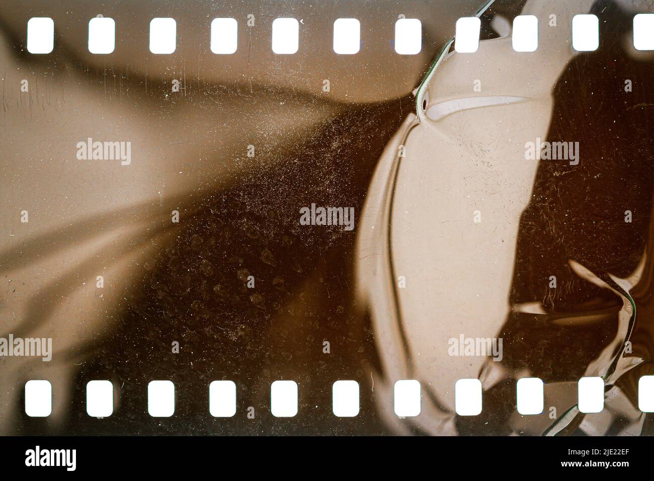 Dusty and grungy 35mm film texture or surface. Perforated scratched ...