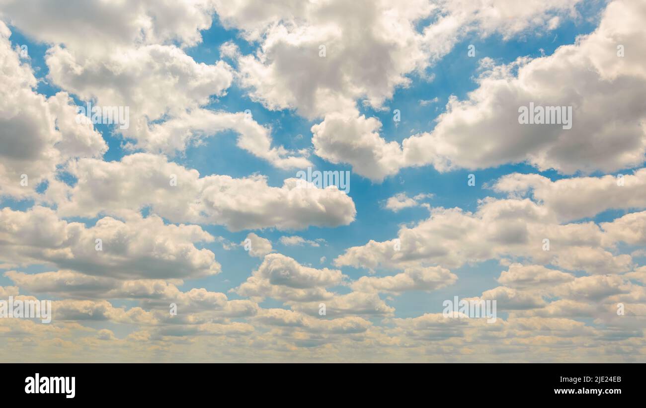 Blue sky, fluffy smooth clouds, flying cloudscape Stock Photo - Alamy