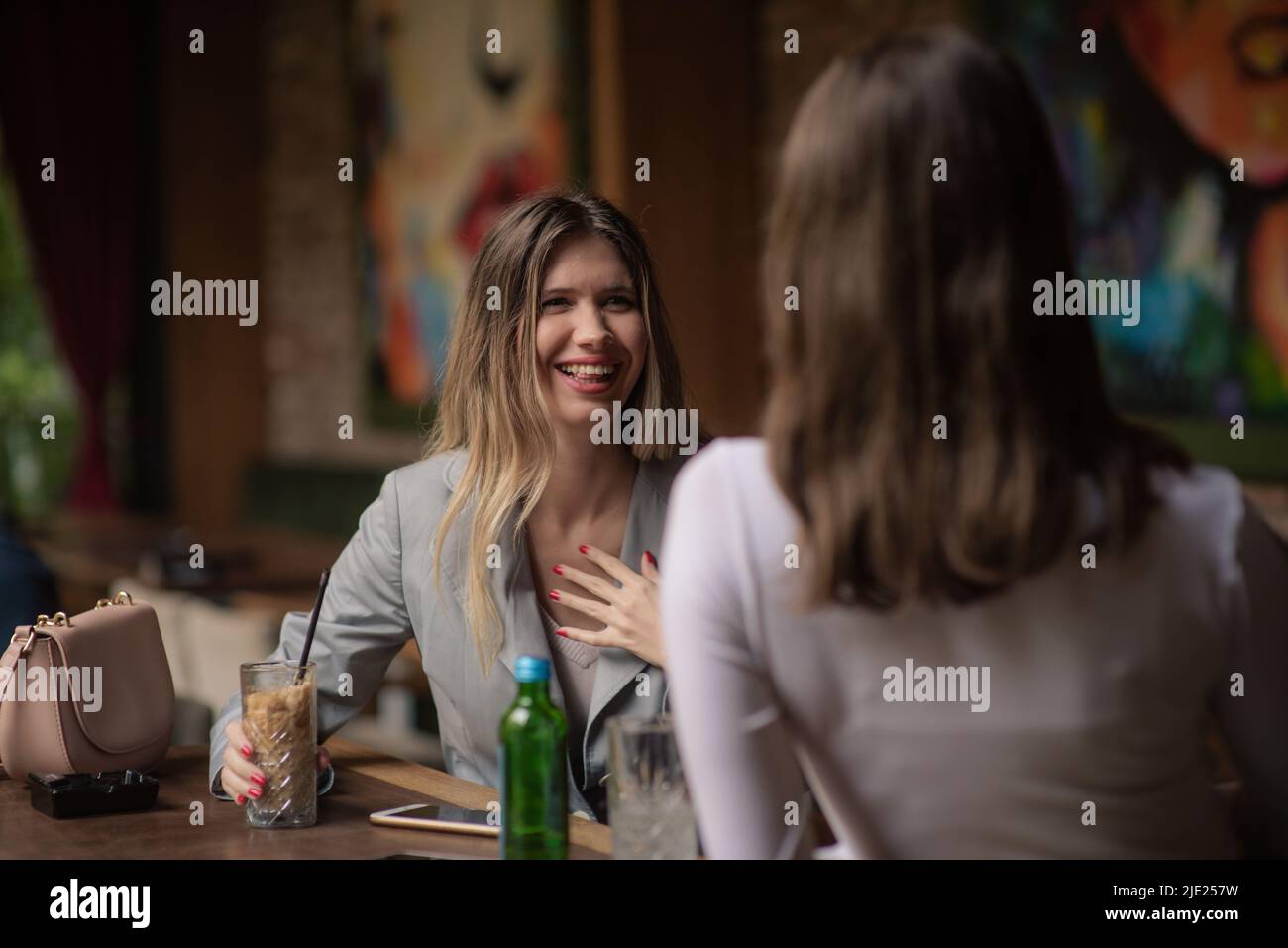 Amazing and beautiful girl is laughing while enjoying her time with her ...