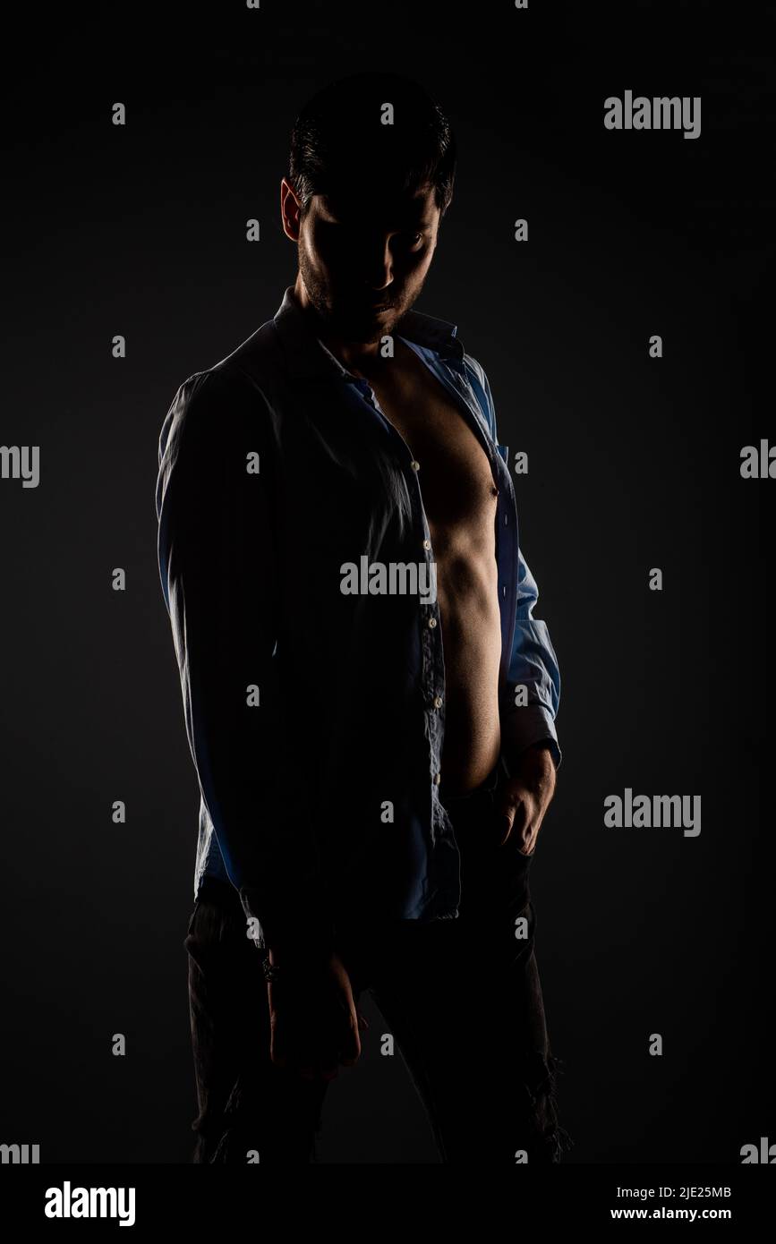 Dimmed light man hi-res stock photography and images - Alamy