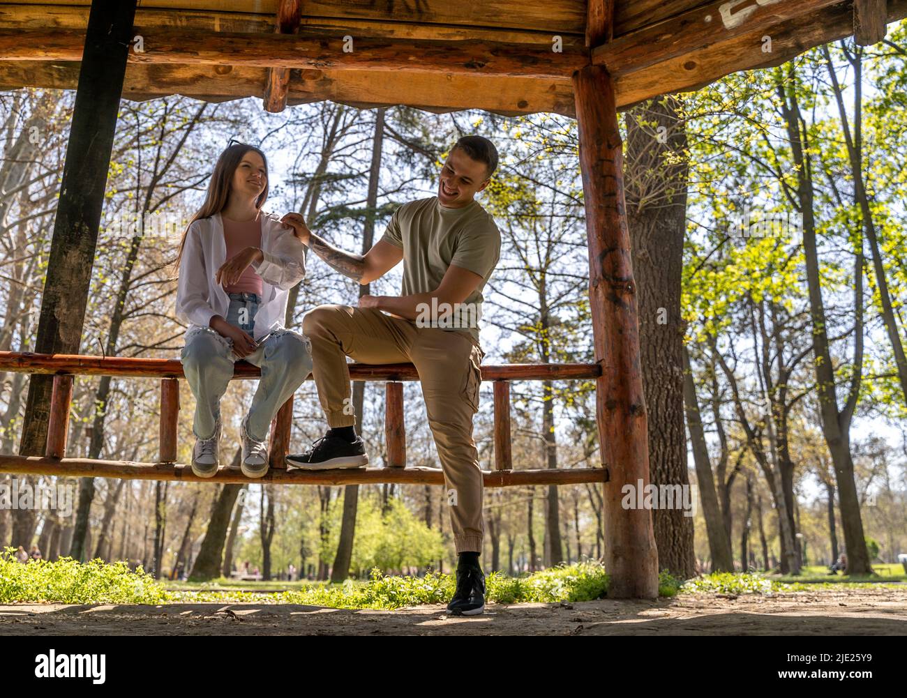 Sweet couple laughing and enjoying in beautiful spring weather while ...