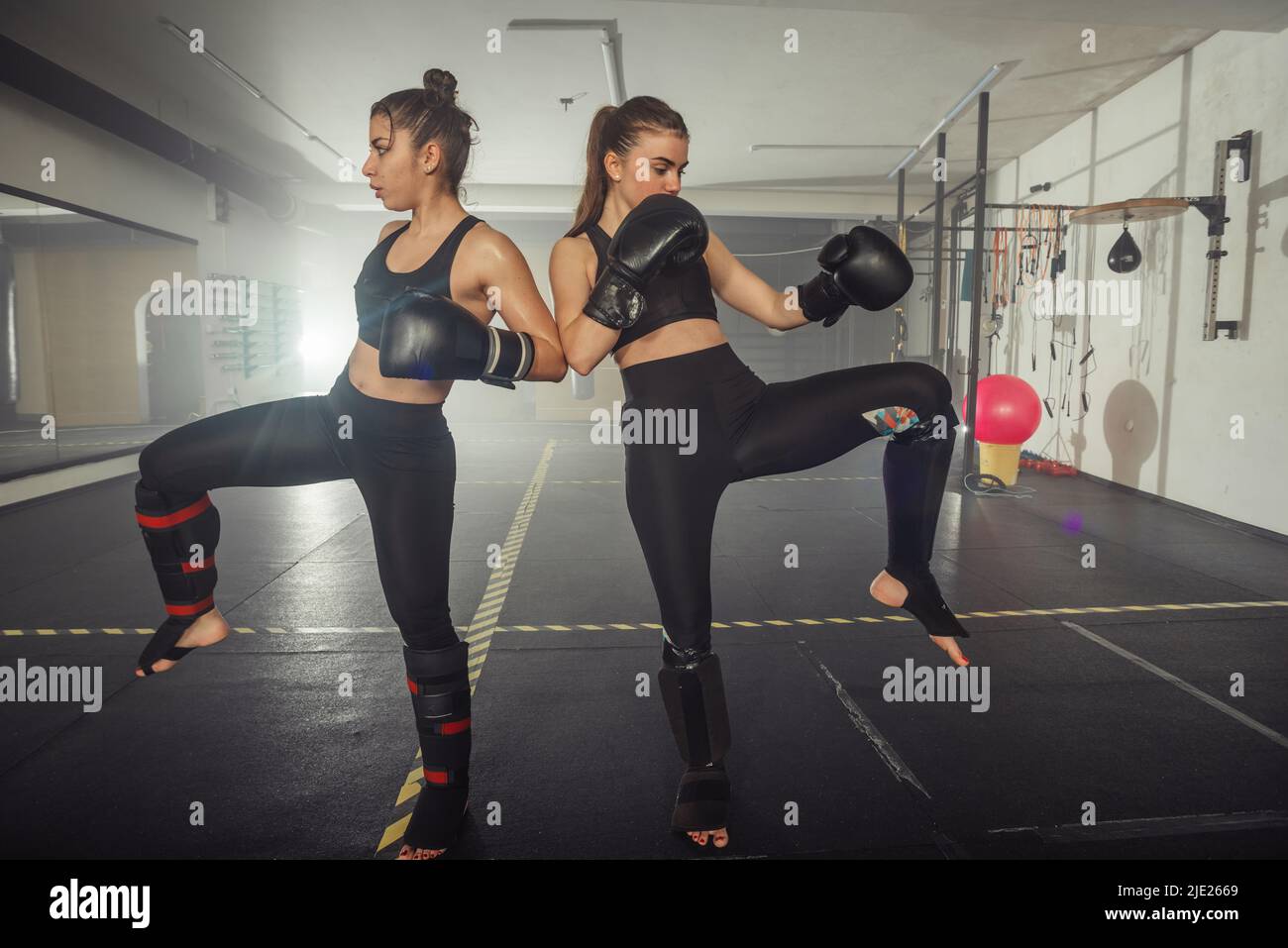 Female kickboxer doing a side kick Stock Photo - Alamy