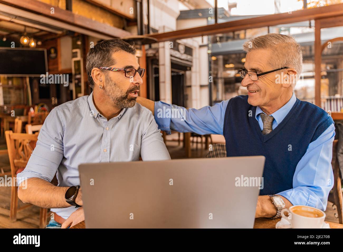 Two senior businessmen are having a discussion about their ideas Stock ...