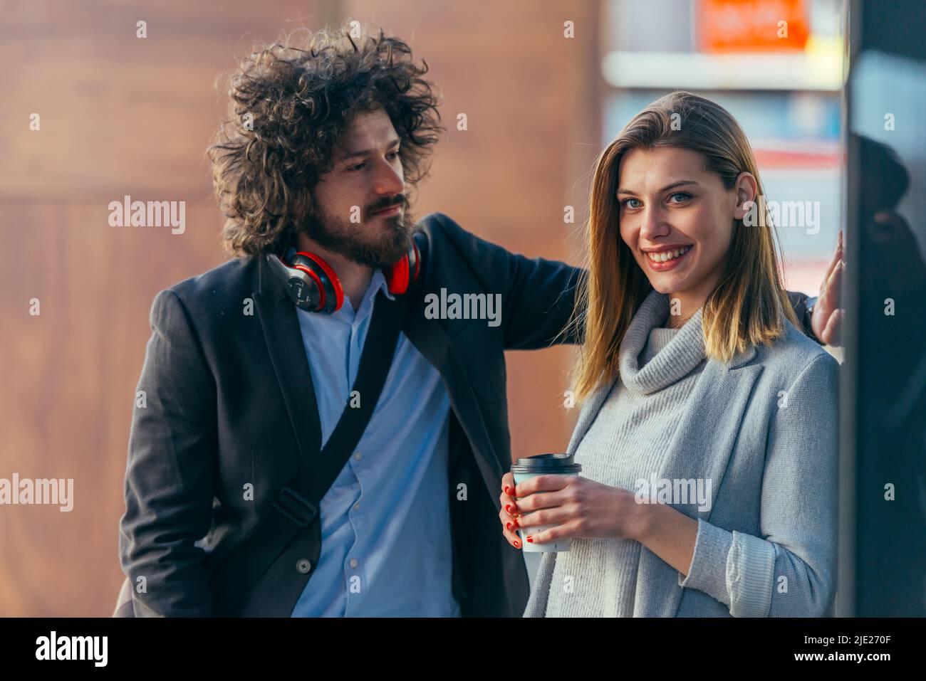 College student flirting with his female friend at university while ...