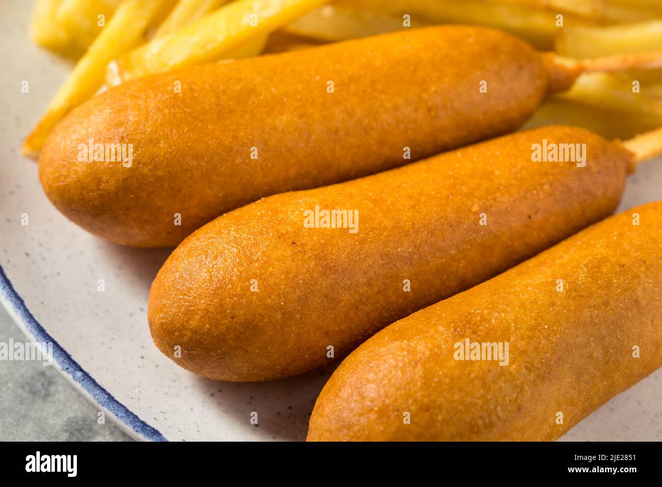 Homemade Breaded Beef Corndogs with French Fries Stock Photo - Alamy