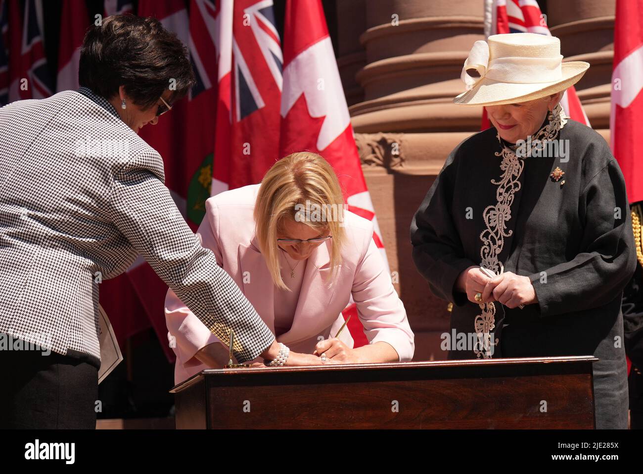 Sylvia Jones, Deputy Premier and Minister of Health signs as she takes her oath at the swearing ...