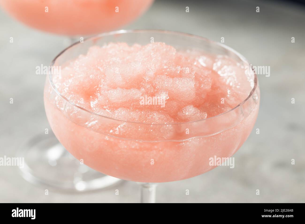 Homemade Boozy Frozen Rose Frose Slushie in a Coupe Glass Stock Photo ...