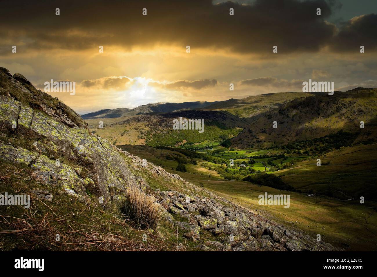 Welsh sunset mountain scene looking down into the valley with golden ...