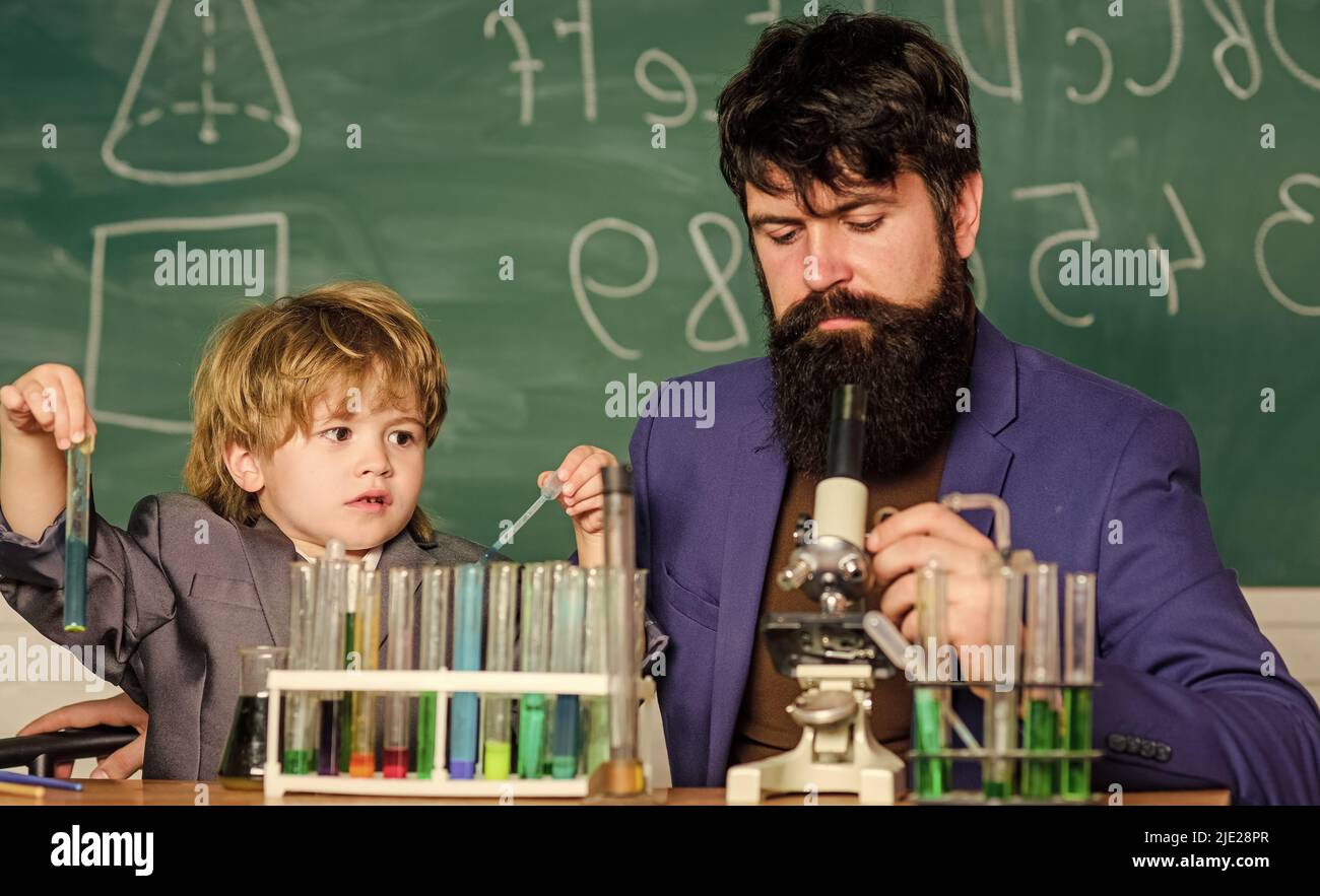 Teacher bearded man father and child test tubes. Chemical experiment ...