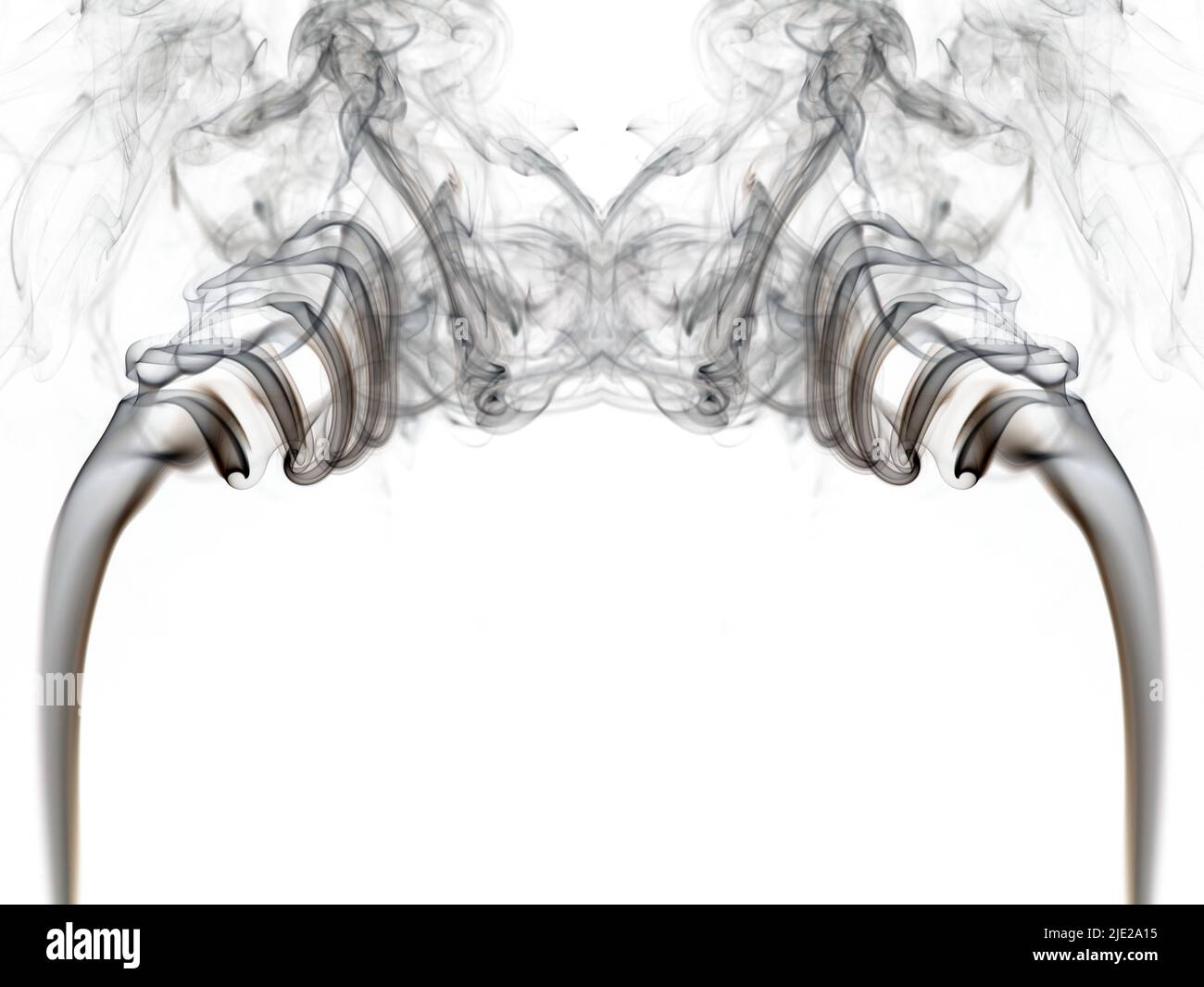 Puffs and curls of dark smoke on a white background rising from a ...