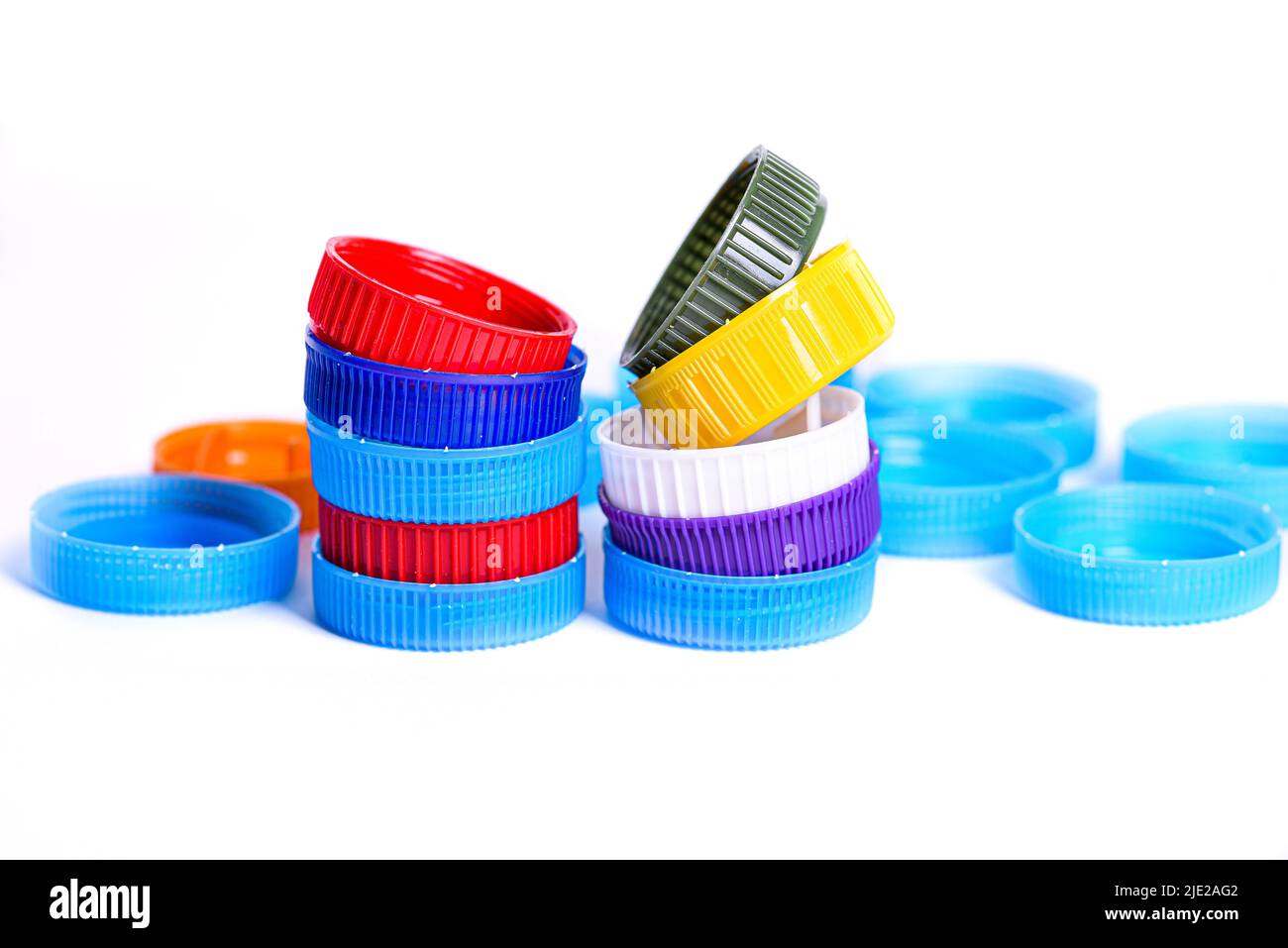 Big colored bottle plastic cap zero waste recycling on white background ...