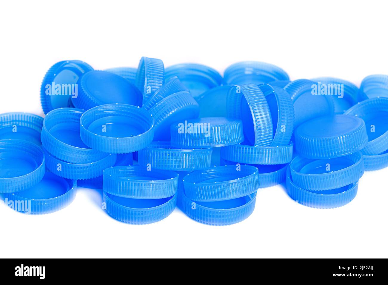 Big colored bottle plastic cap zero waste recycling on white background ...