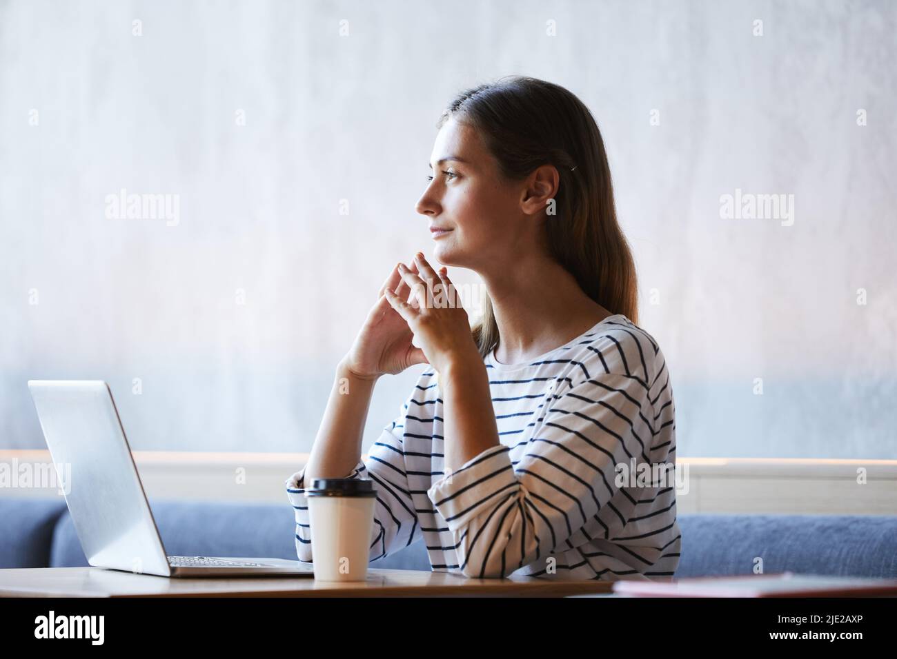 Brown hair lady thinking hi-res stock photography and images - Alamy