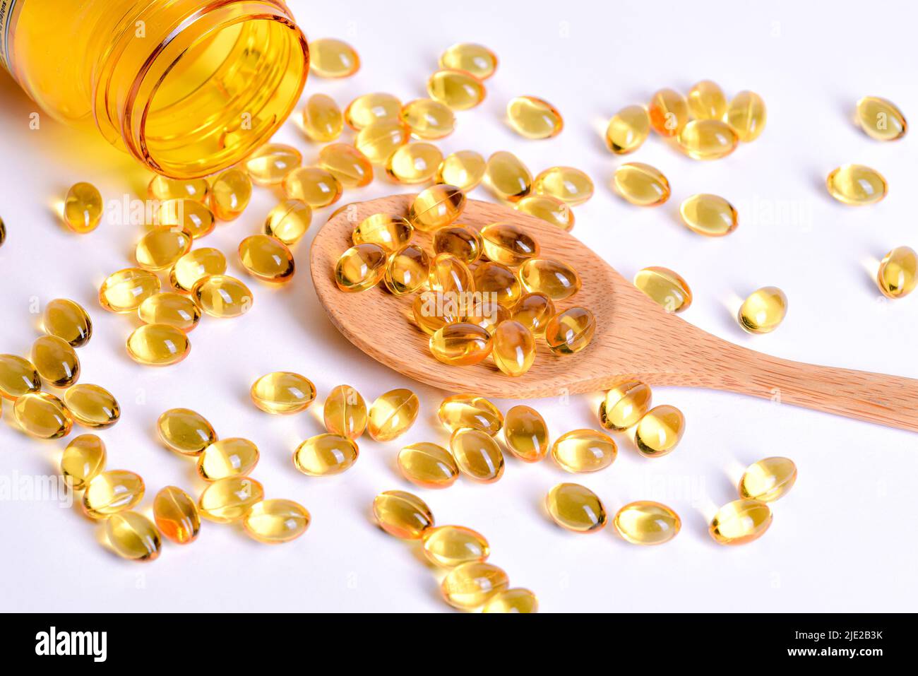 Vitamin D3 Capsules in a spoon with other vitamin D3 capsules around ...