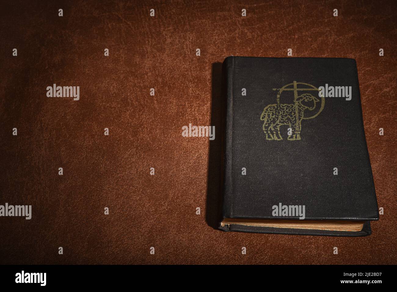 The Book of Pray. Ancient Prayer Book with Lamb of God Symbol on Cover ...