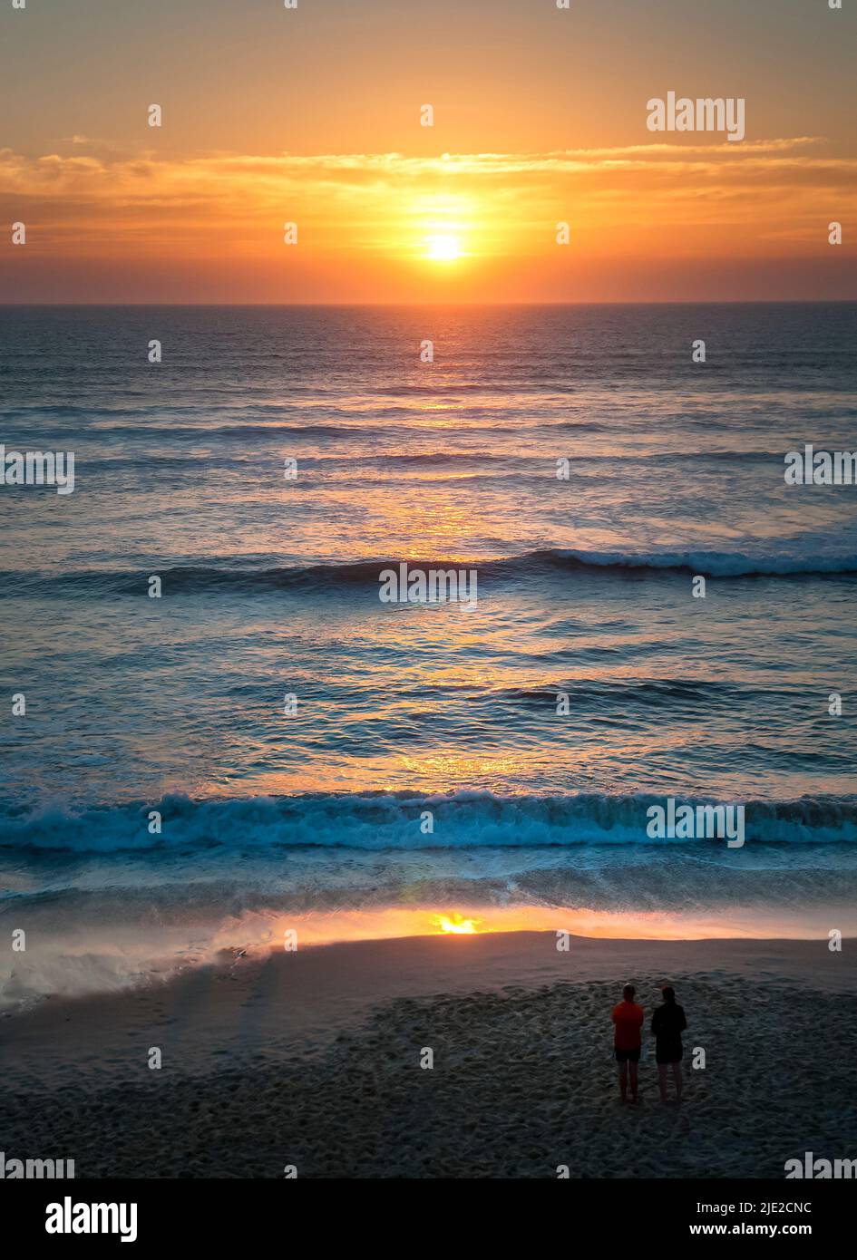 2 people watching the sunset at Hourtin Plage, Gironde, South West ...
