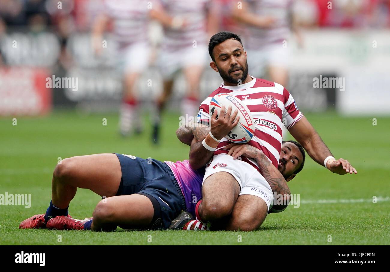 Wigan WarriorsÕ Bevan French is tackled by Toulouse OlympiqueÕs Nathan ...