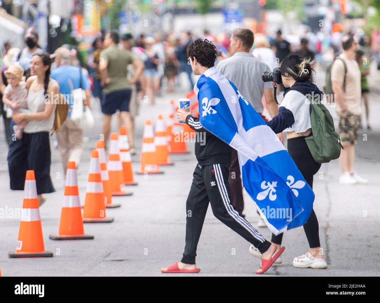Montreal, Canada. 24th June 2022. A man wears a Quebec flag as he ...