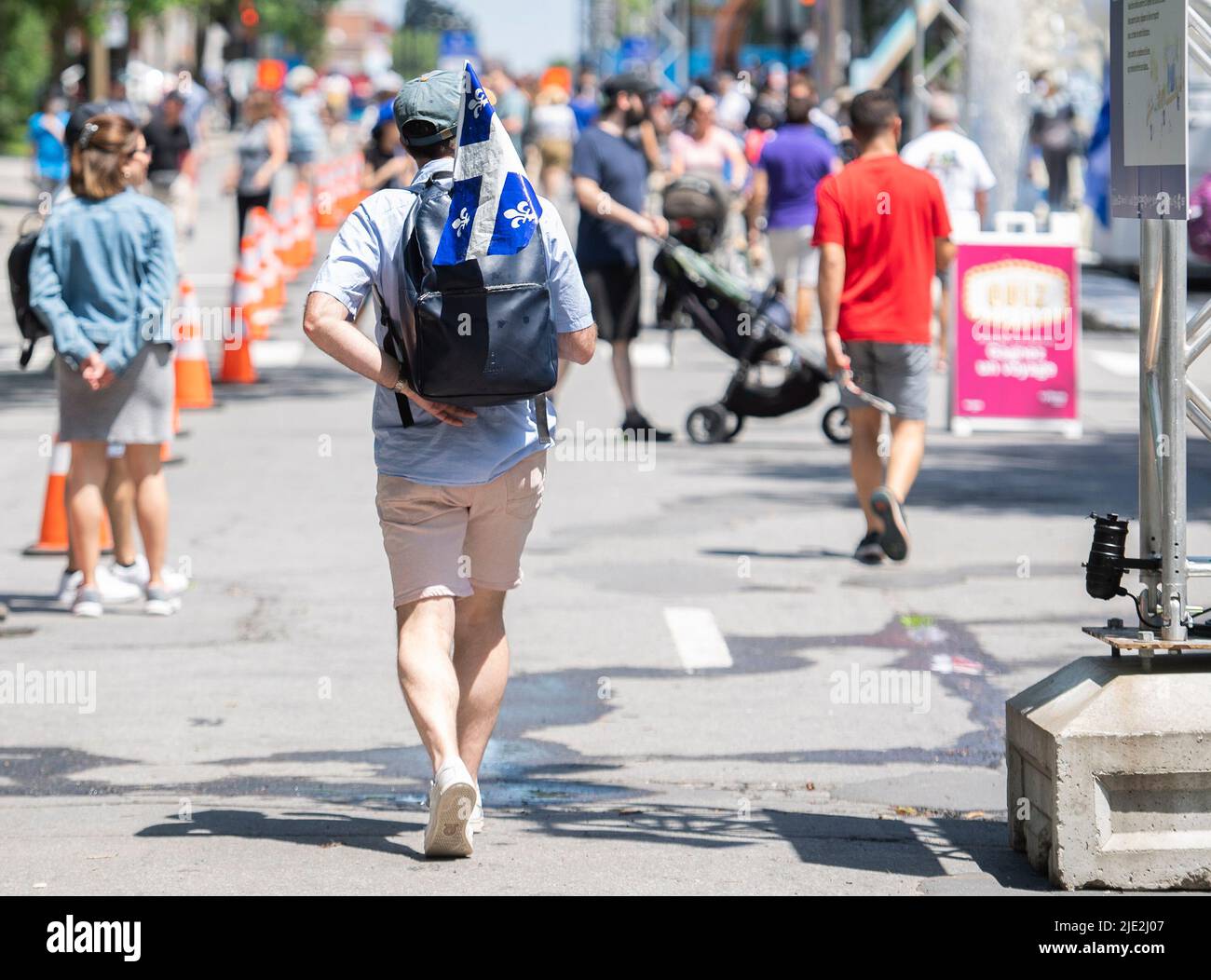 Montreal, Canada. 24th June 2022. A man wears a Quebec flag on his ...