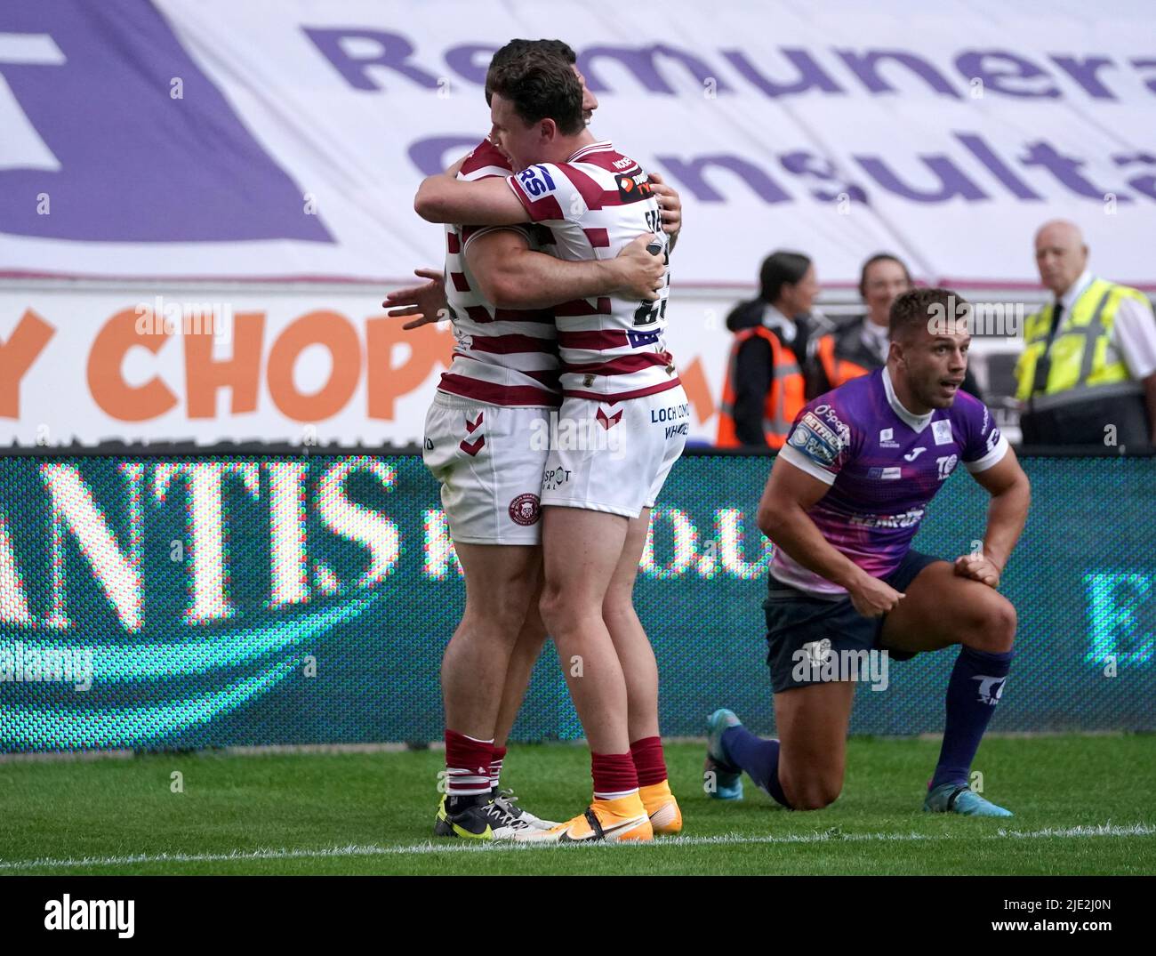 Wigan WarriorsÕ Abbas Miski (left) celebrates scoring his sides fourth ...