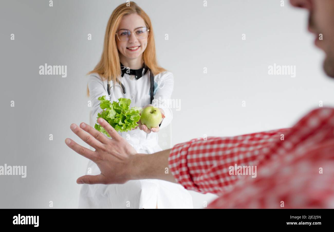a man ignores the suggestion of a nutritionist vegetables fruits ...