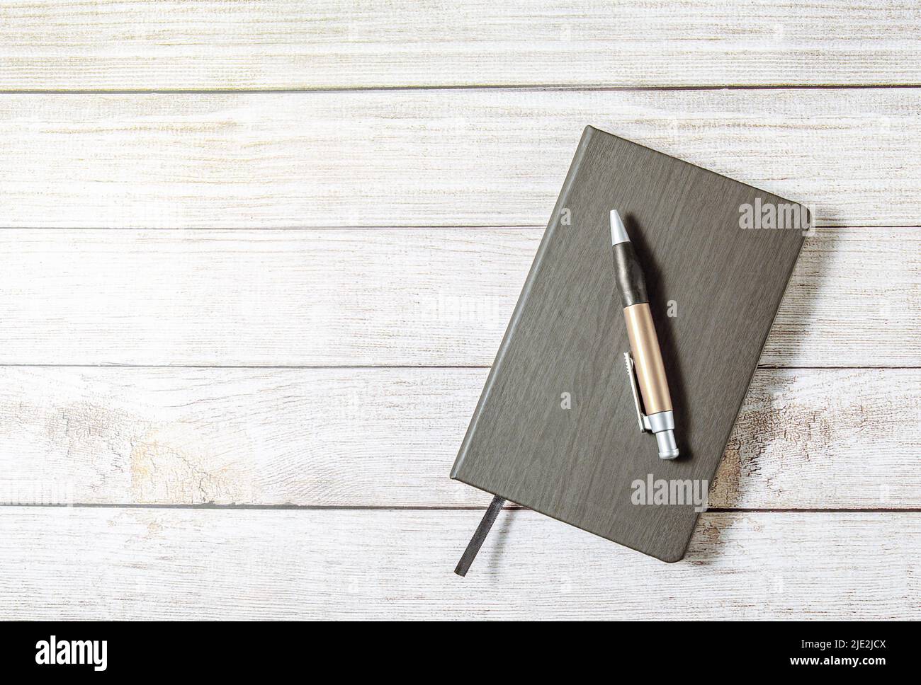 Notebook on wooden table, vintage picture tone, ready to add text or ...