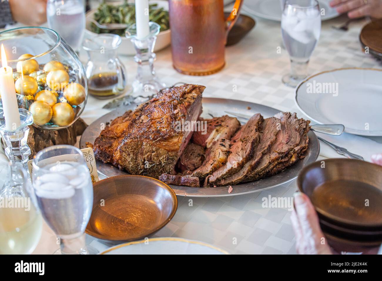 A fully cooked and sliced roast beef celabratory family dinner on the ...
