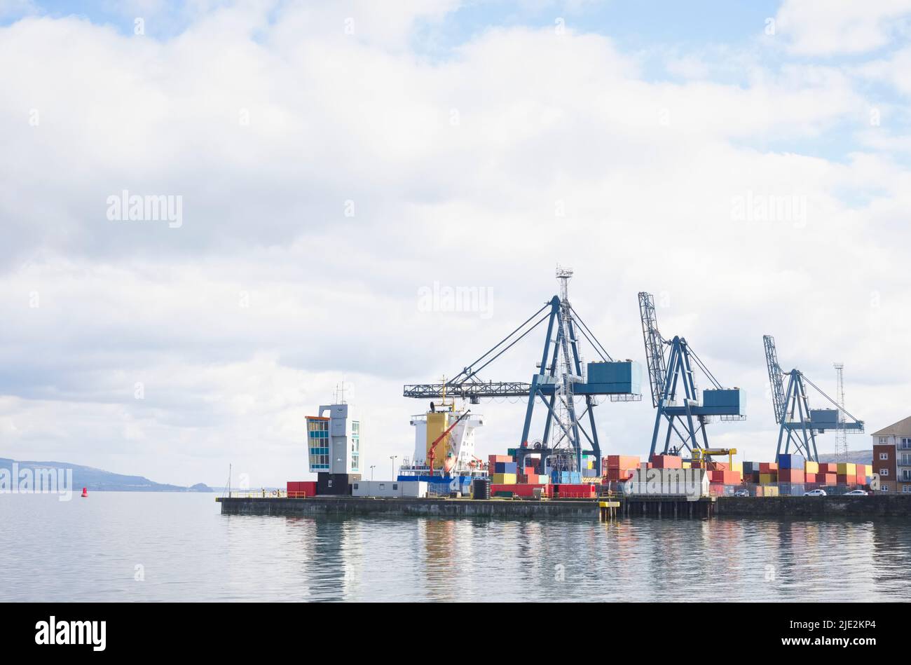 Cranes at logistics port terminal for offloading containers Stock Photo ...