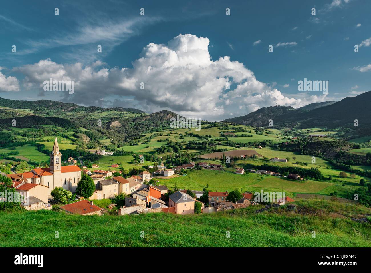 Scenic alpine town in the green mountain valley. Picturesque view in ...