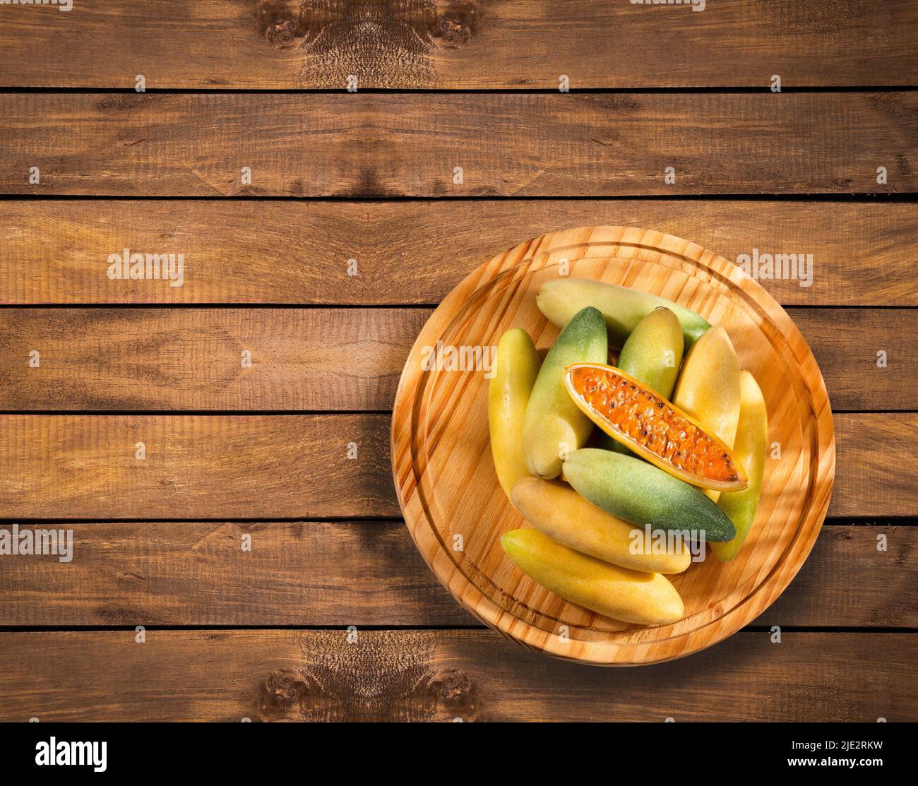 Exotic tropical organic curuba - Passiflora tripartita Stock Photo - Alamy