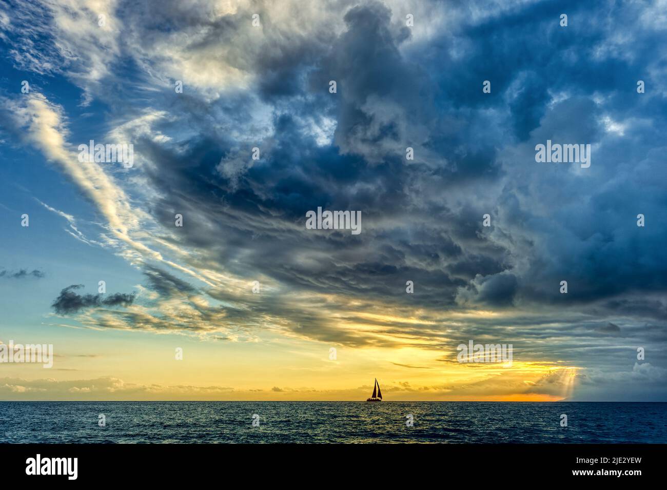 A Storm Is Looming Overhead As A Small Boat Moves Toward The The ...