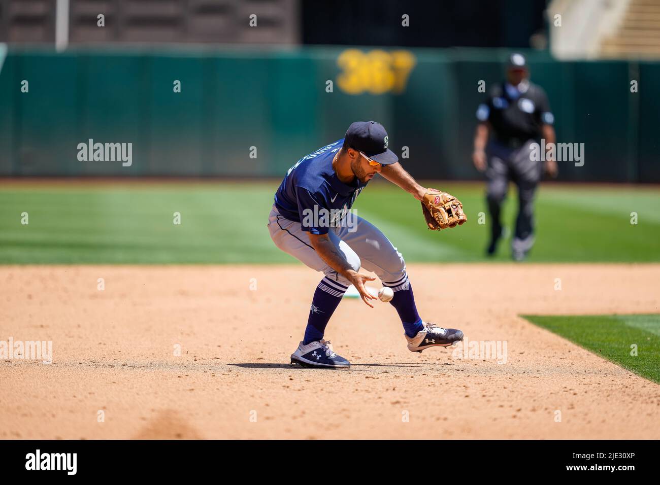 Seattle Mariners Infielder Abraham Toro (13) catches a ground ball ...