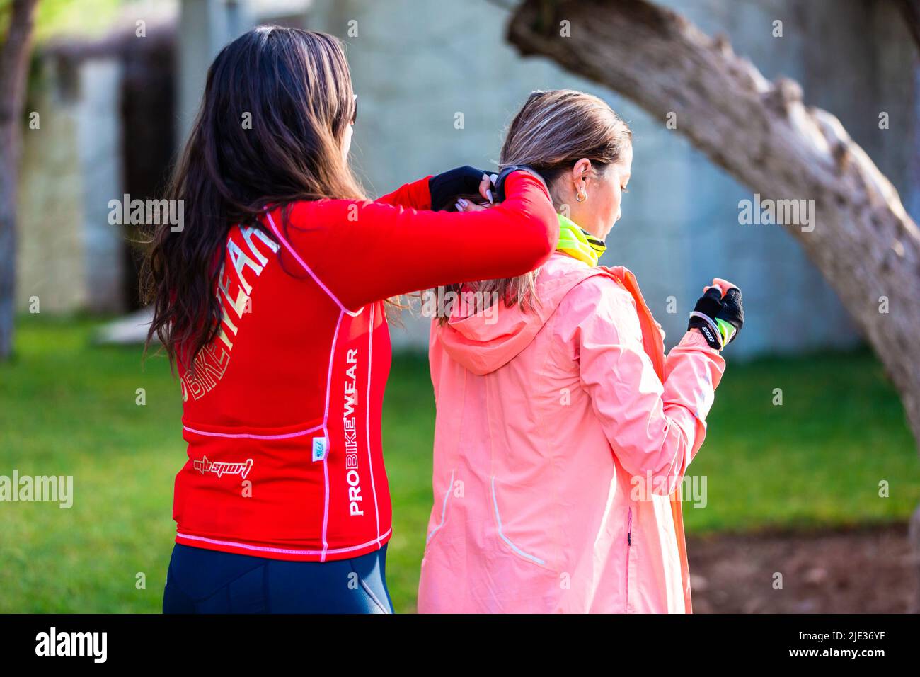 Marrakech, Morocco - 02 December 2021 : A girl braids her friend’s hair ...
