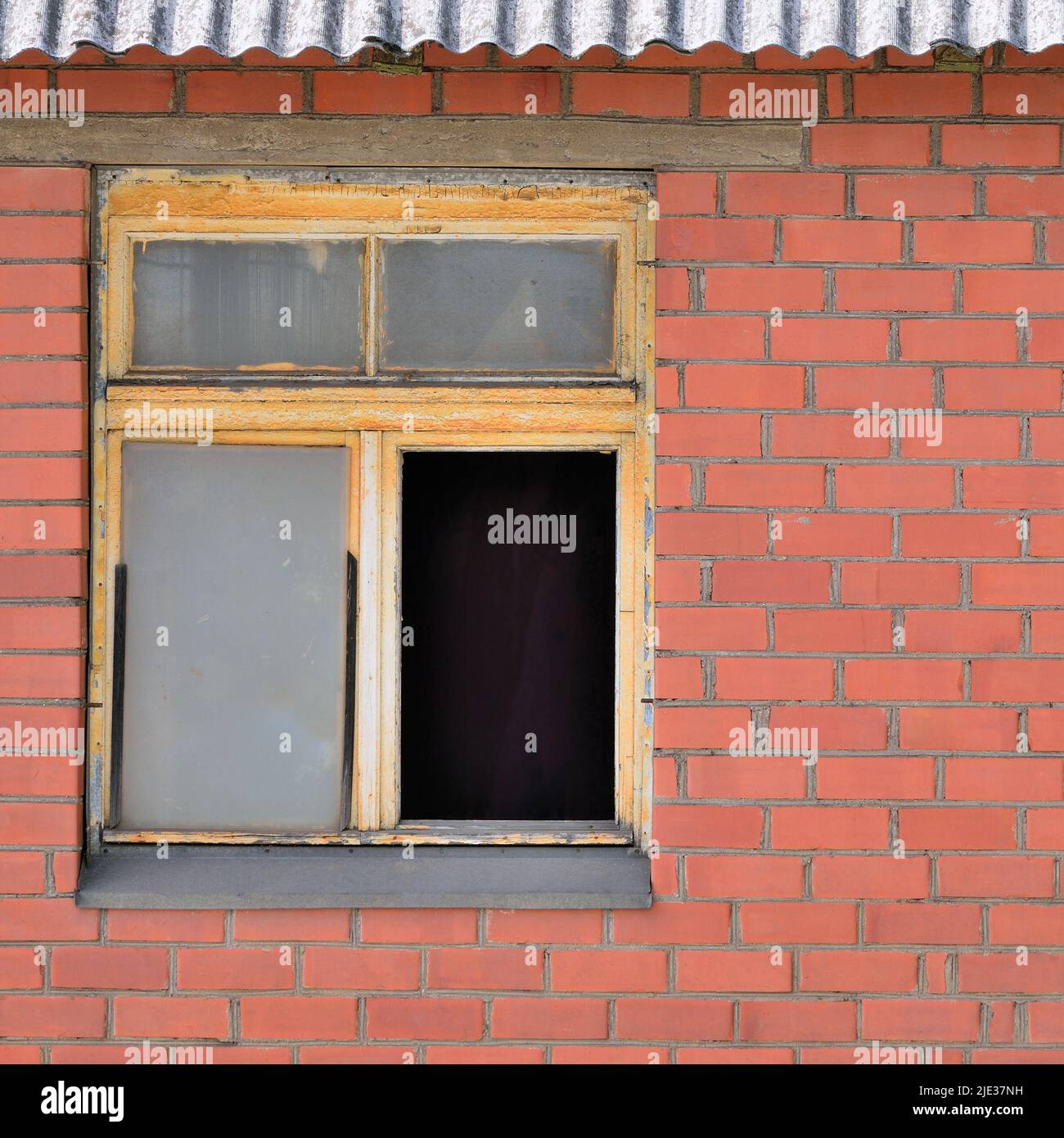 Old aged shed broken window glass, red bricks hut wall background ...
