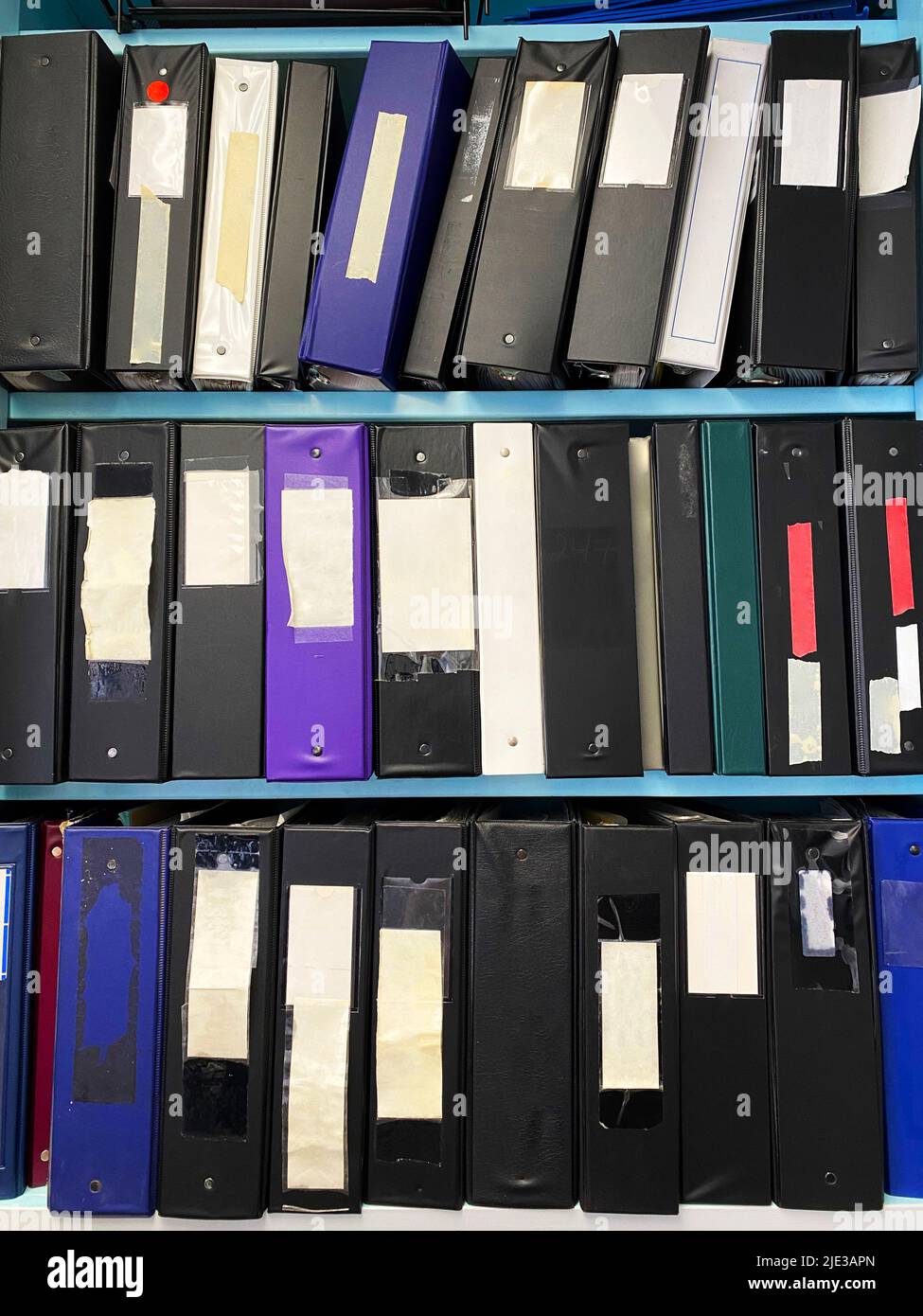 Binders on a shelf Stock Photo - Alamy