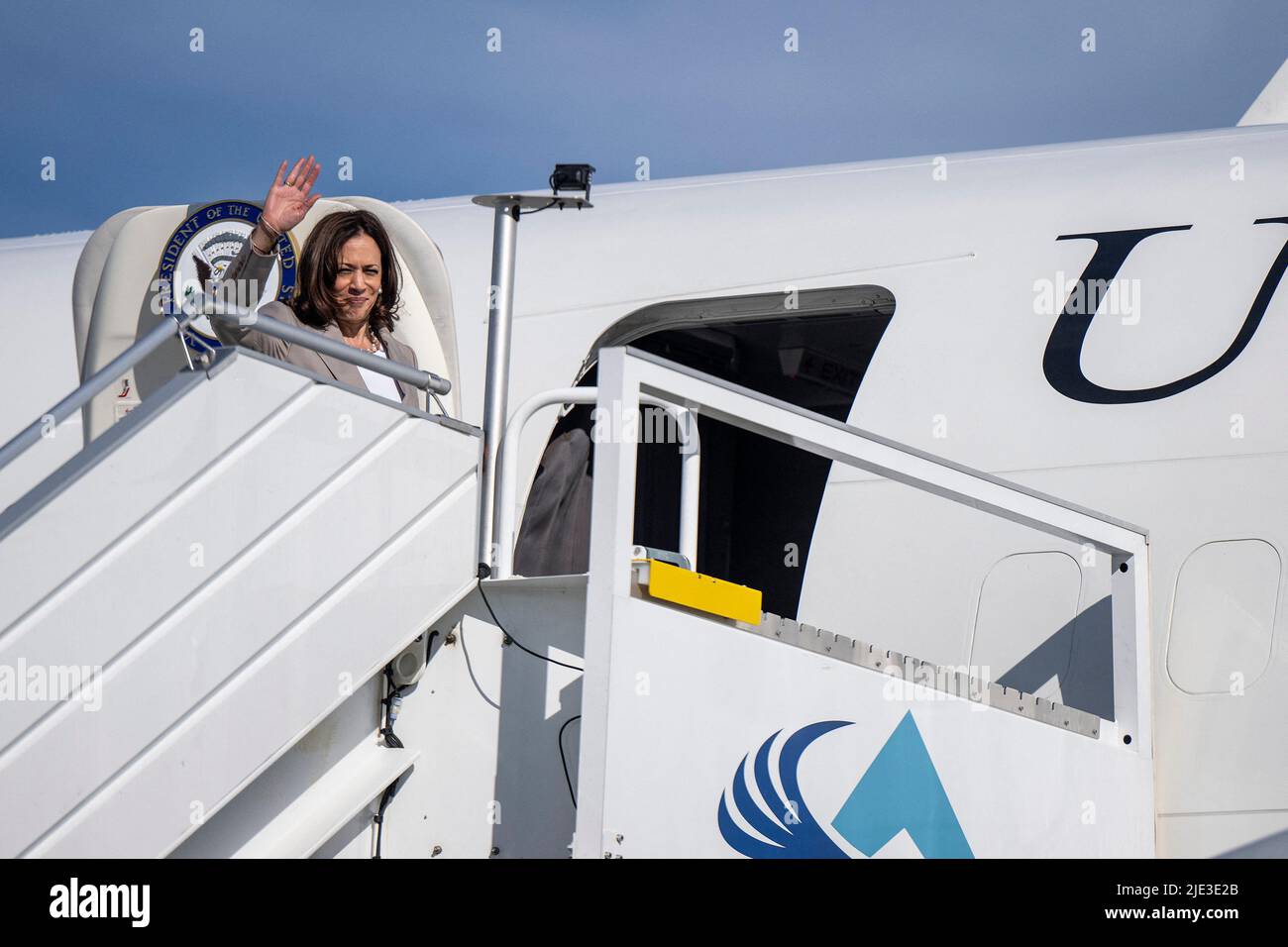 Vice President Kamala Harris waves from the top of the steps before ...