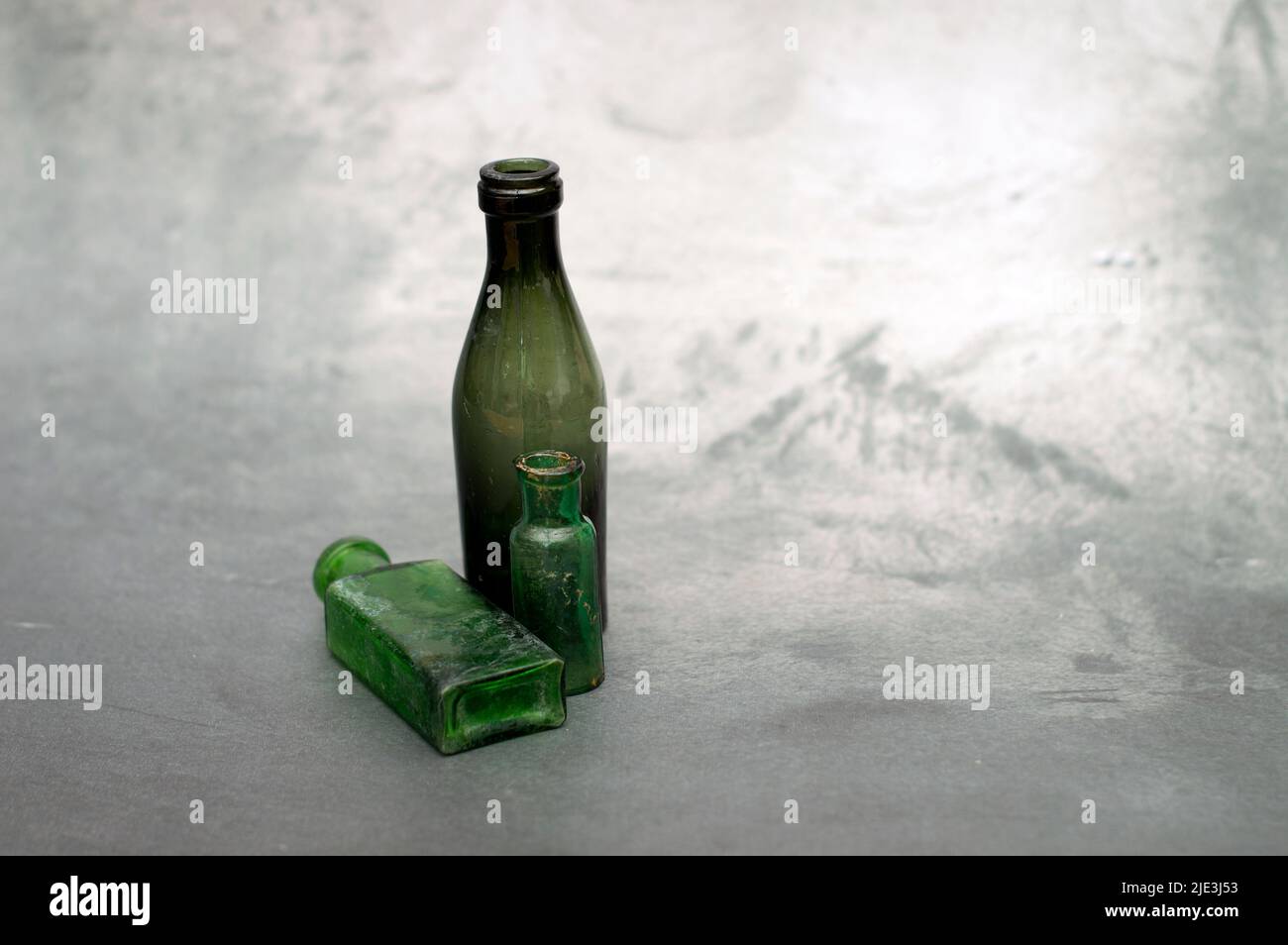 Three green bottles Stock Photo - Alamy
