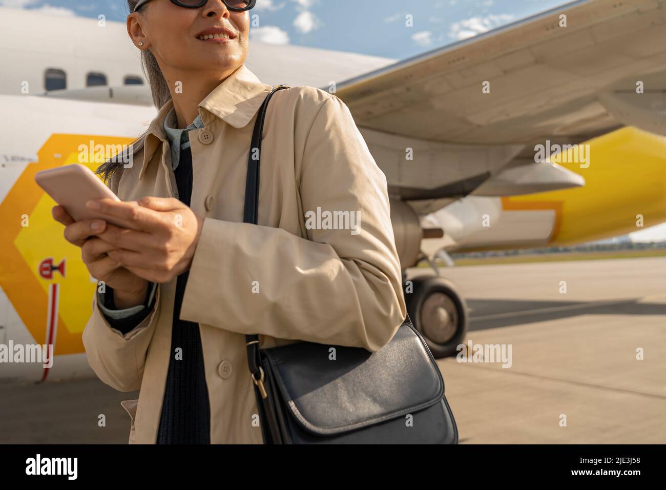 Person standing near airplane close hi-res stock photography and images ...