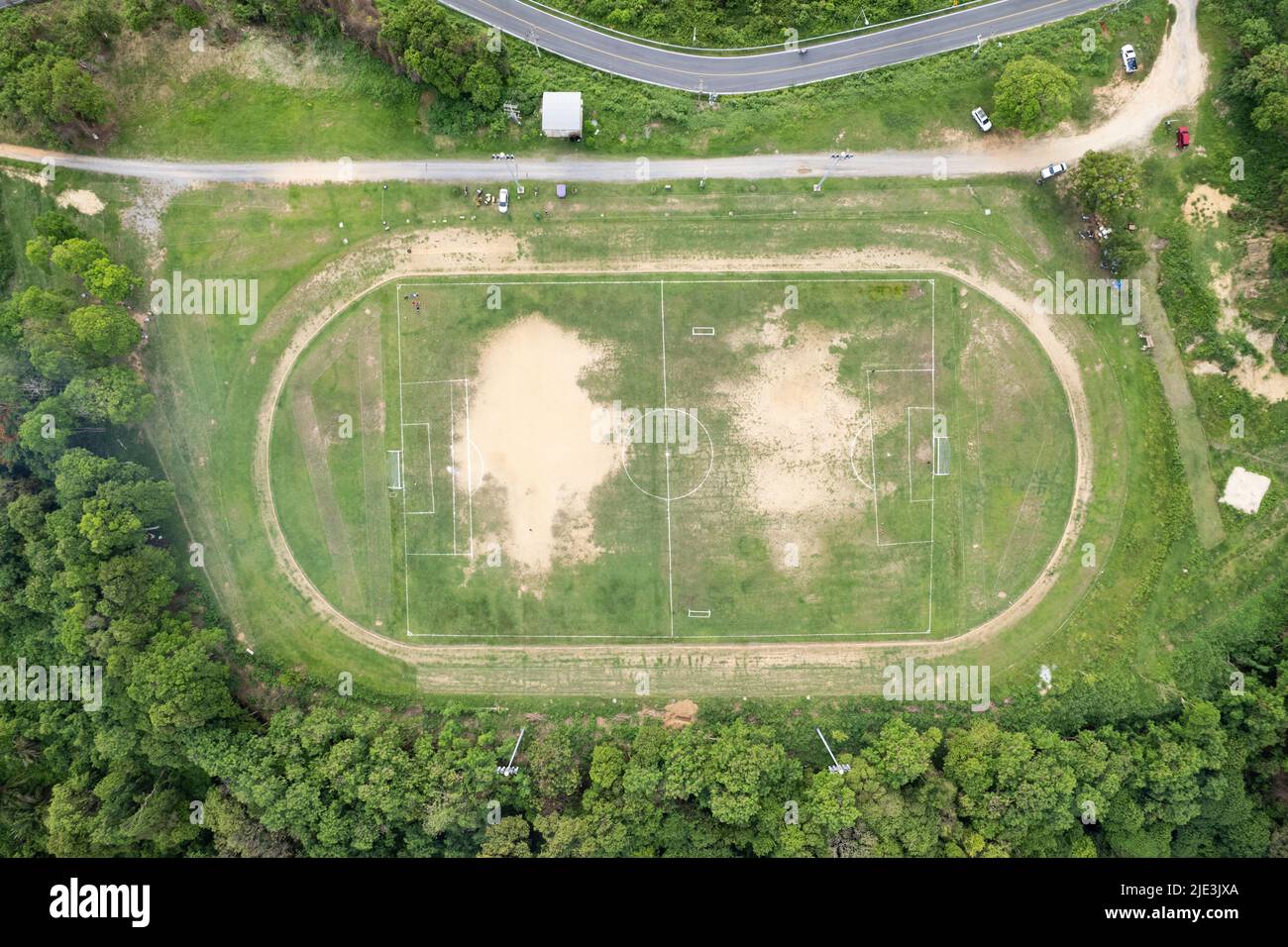 Aerial view of empty green football field with running track outdoor ...