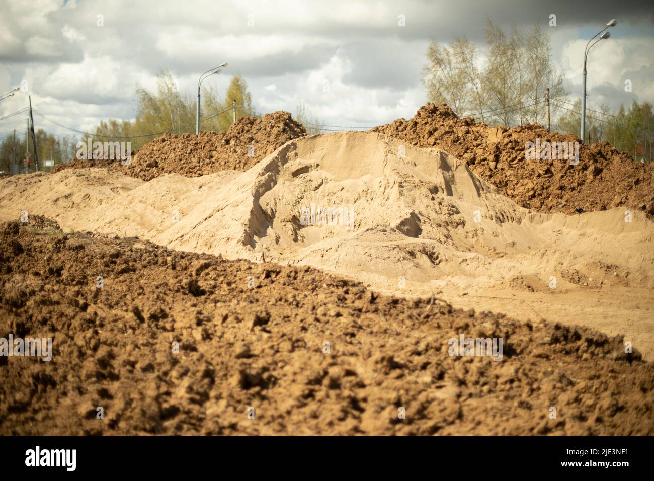 Construction sand. Mountain of sand on construction site. Excavated ...