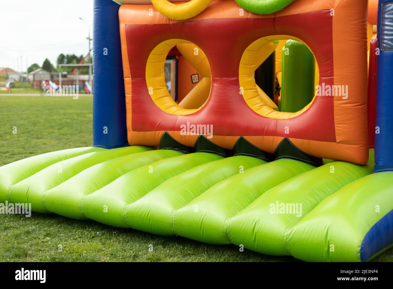 Inflatable construction in amusement park. Obstacle course for children ...