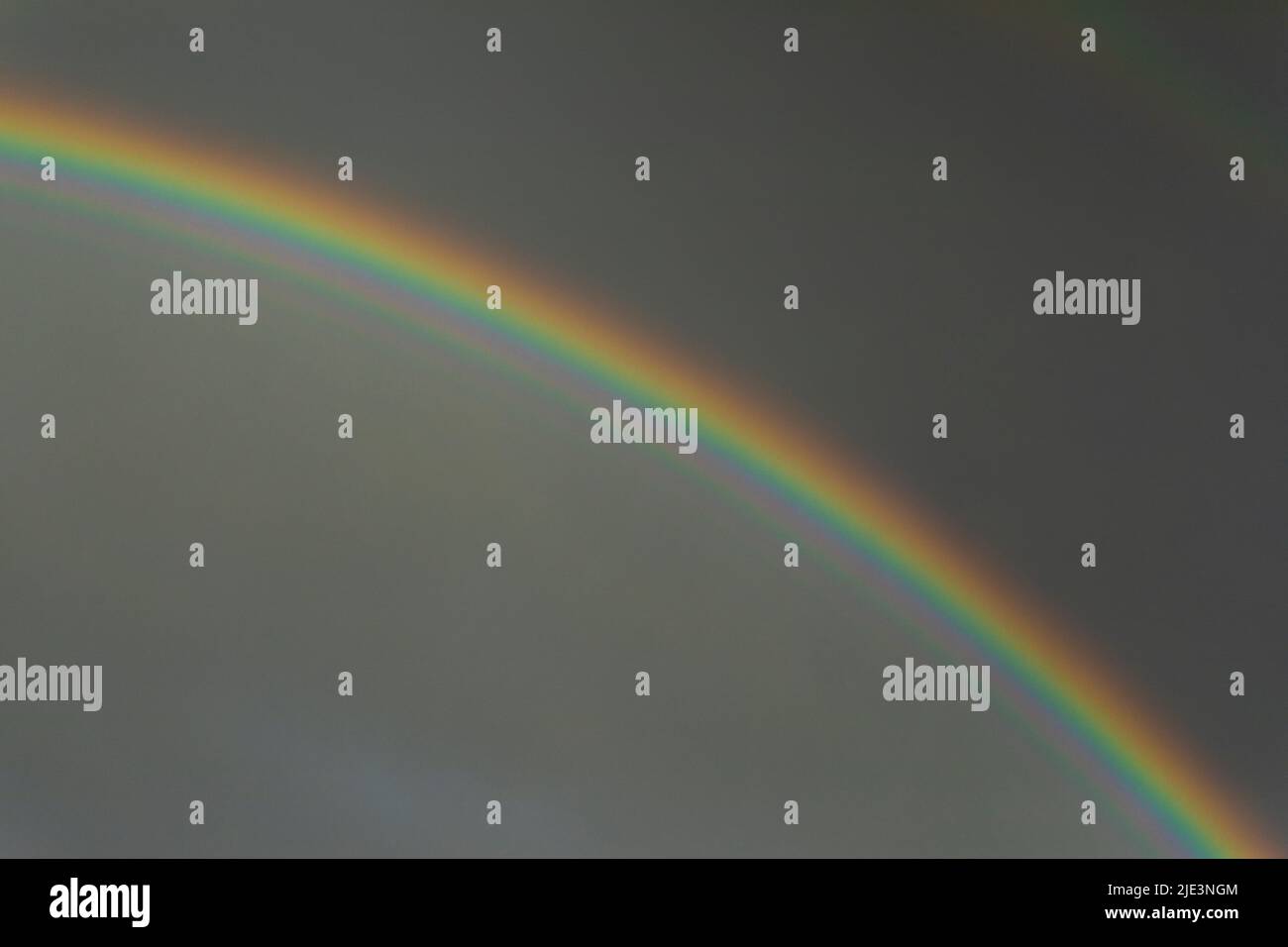 Rainbow in sky. After rain. Phenomenon of nature. Beautiful rainbow of ...