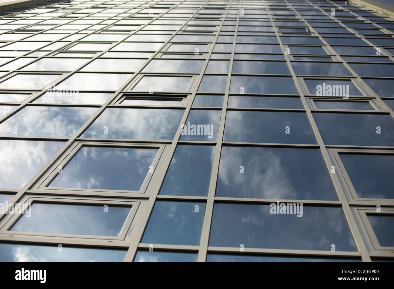 Building is made of glass. Mirror surface in office building. Many ...