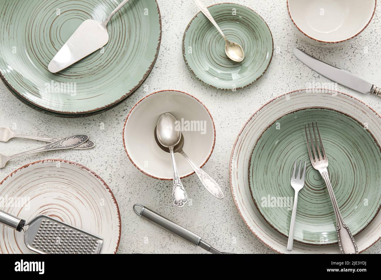 Stylish dinnerware on light background Stock Photo - Alamy