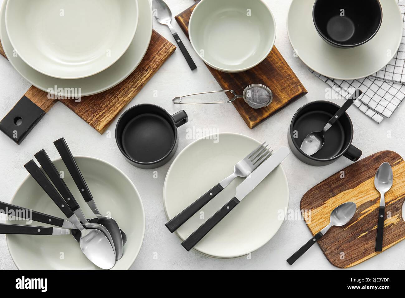 Set of clean dinnerware on light background Stock Photo - Alamy