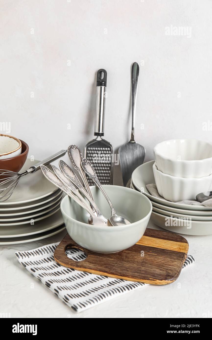 Set of clean dinnerware on light background Stock Photo - Alamy