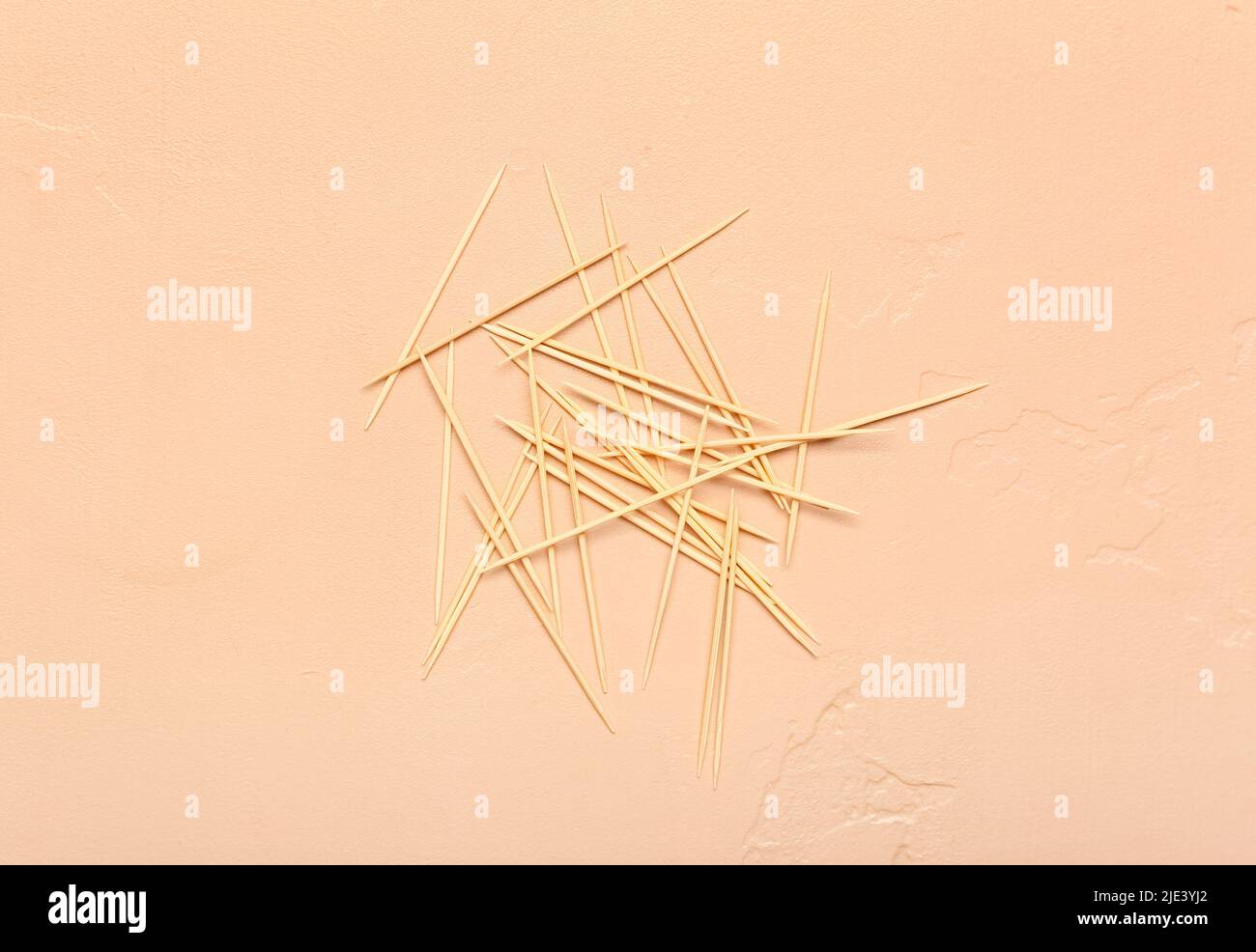 Wooden toothpicks on color background Stock Photo - Alamy
