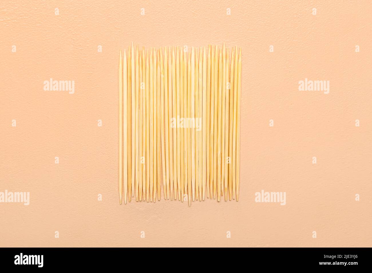 Wooden toothpicks on color background Stock Photo - Alamy