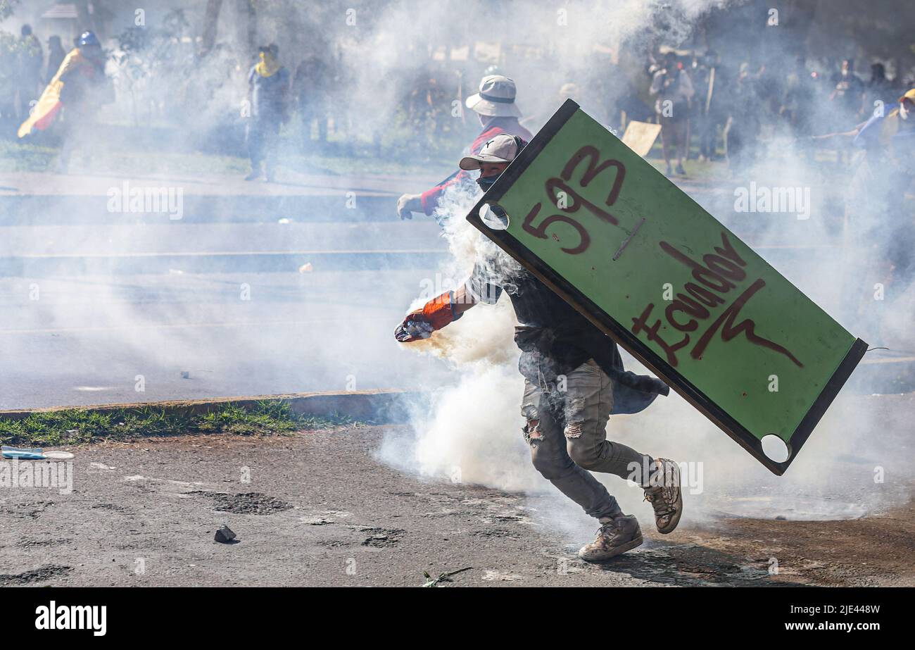 Quito, Ecuador. 23rd June, 2022. A protester throws a teargas bomb ...